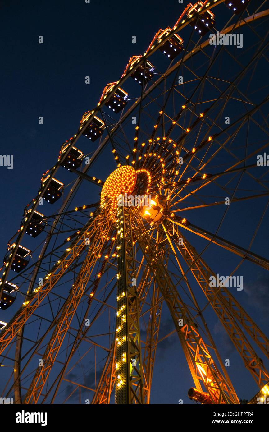 Ferris Wheel Lights at Night. Neon colored lights flashing on the ...