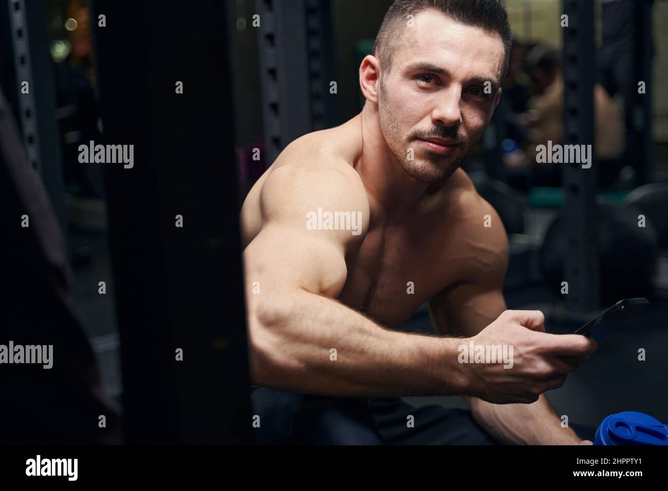 Portrait of handsome sportsman demonstrating his smile Stock Photo - Alamy