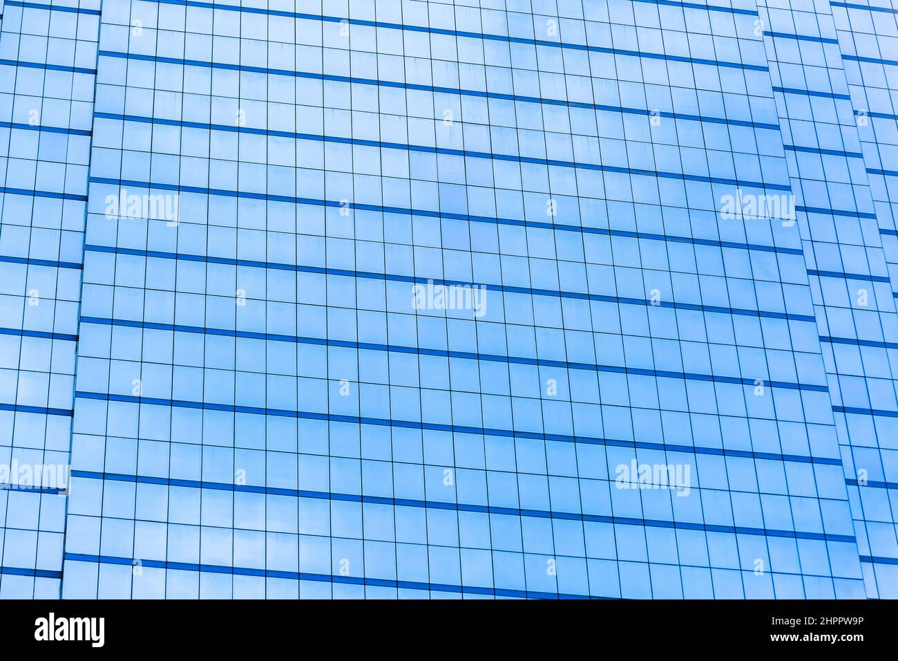Blue glass windows of office building for background Stock Photo - Alamy