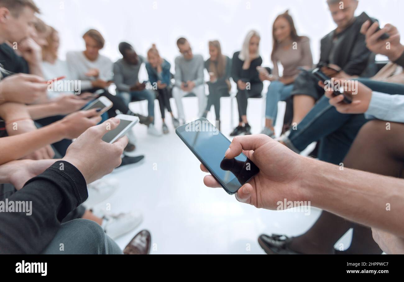 close up. groups of young people with smartphones Stock Photo - Alamy