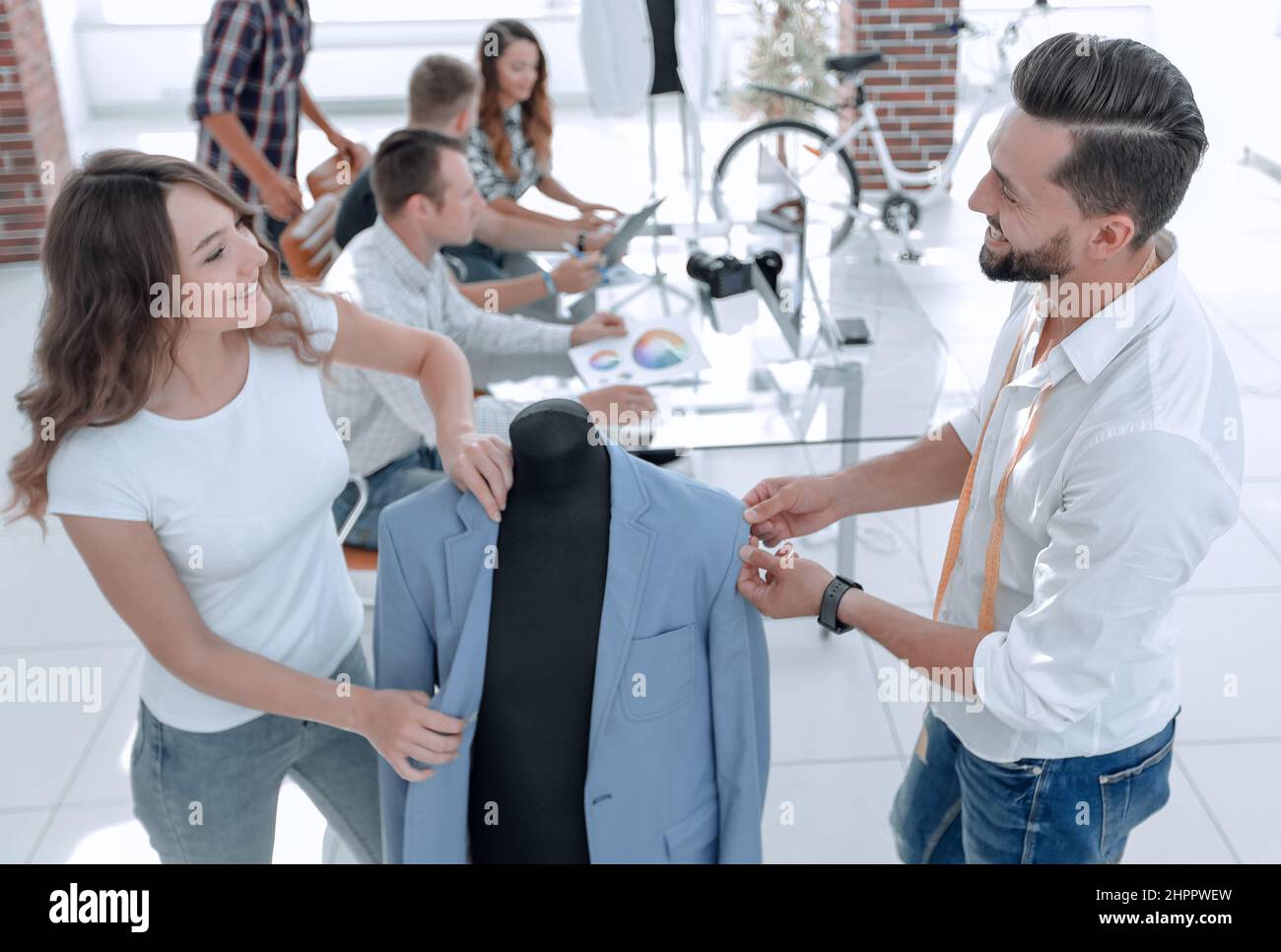 designers working on new models of clothes Stock Photo - Alamy