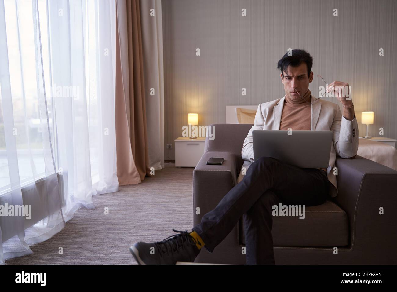 Focused man working on his portable computer Stock Photo - Alamy