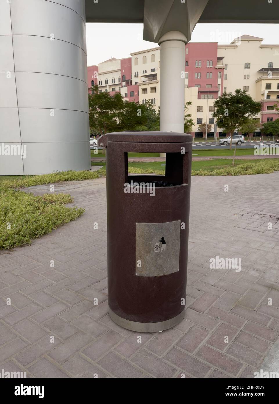 A Trash / Garbage can placed strategically on the street or pathway to ...
