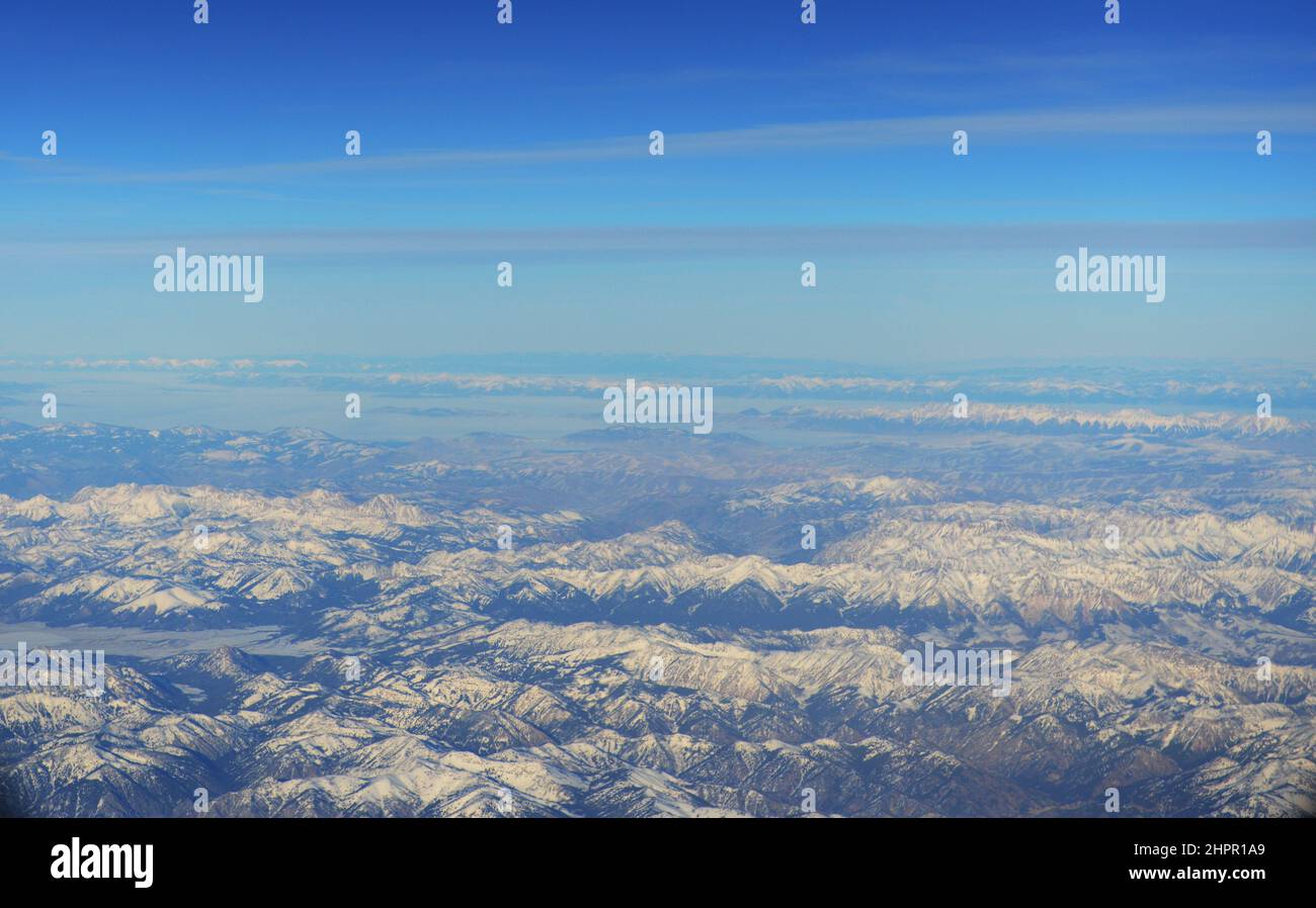 Flying over snow covered mountains in the North western part of the USA ...
