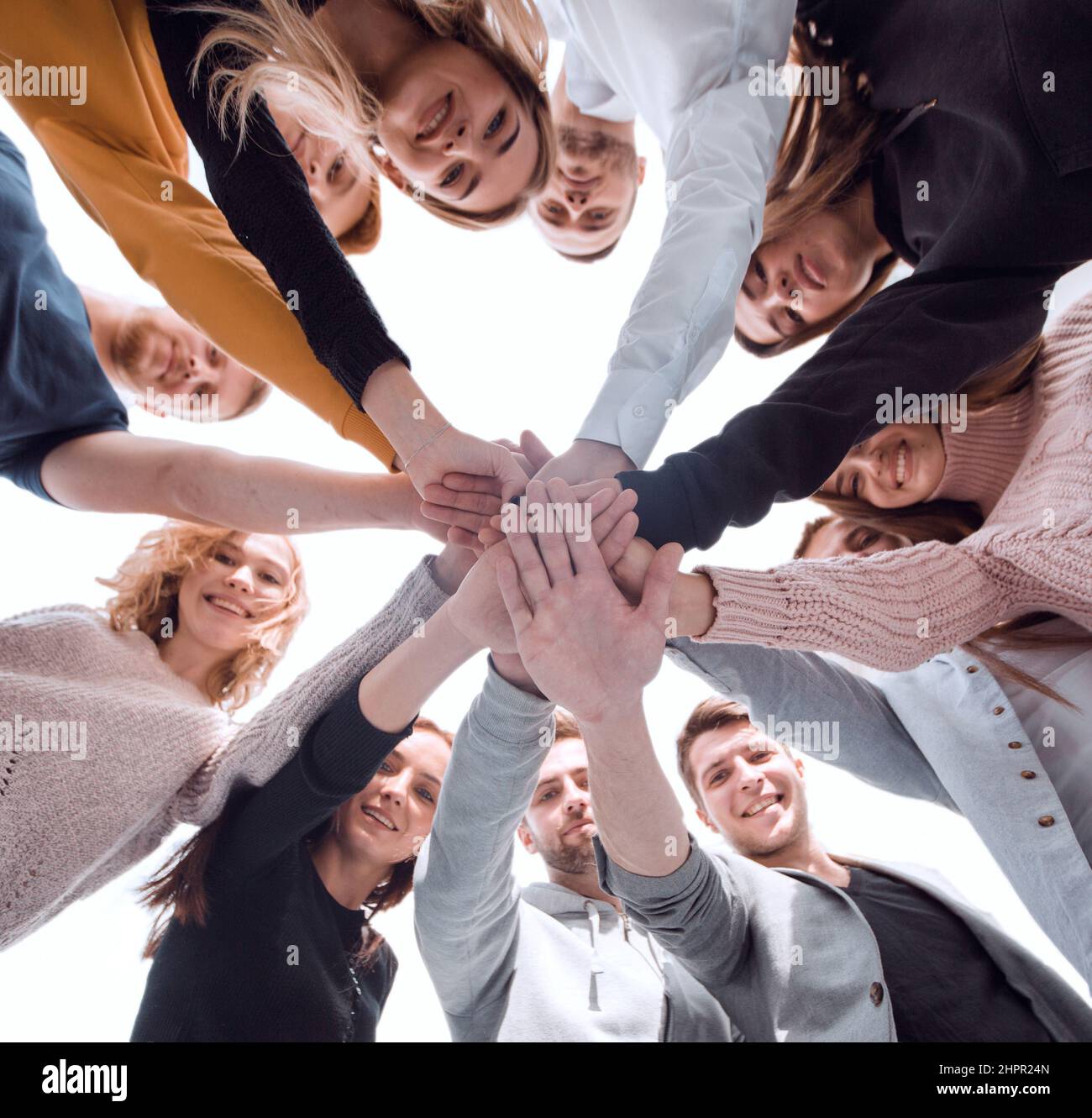bottom view. a group of young people showing their unity Stock Photo ...