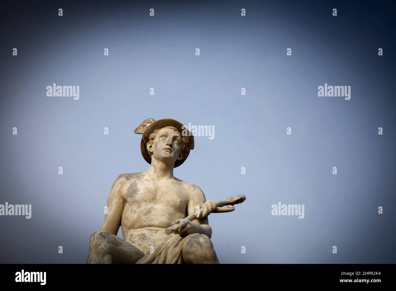An ancient statue of antique god of commerce, business, merchants and ...