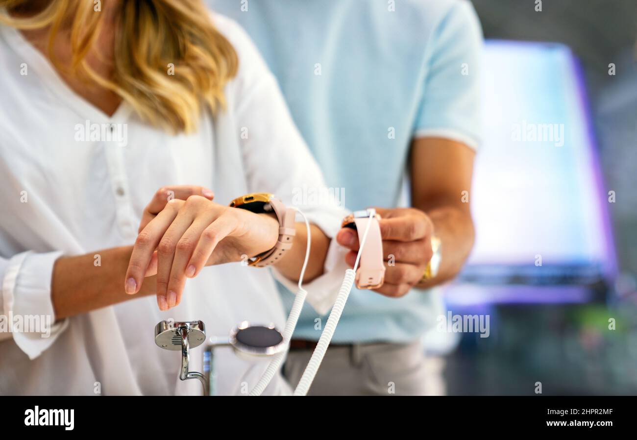 Technology people smart devices concept. Happy couple buying new smart ...