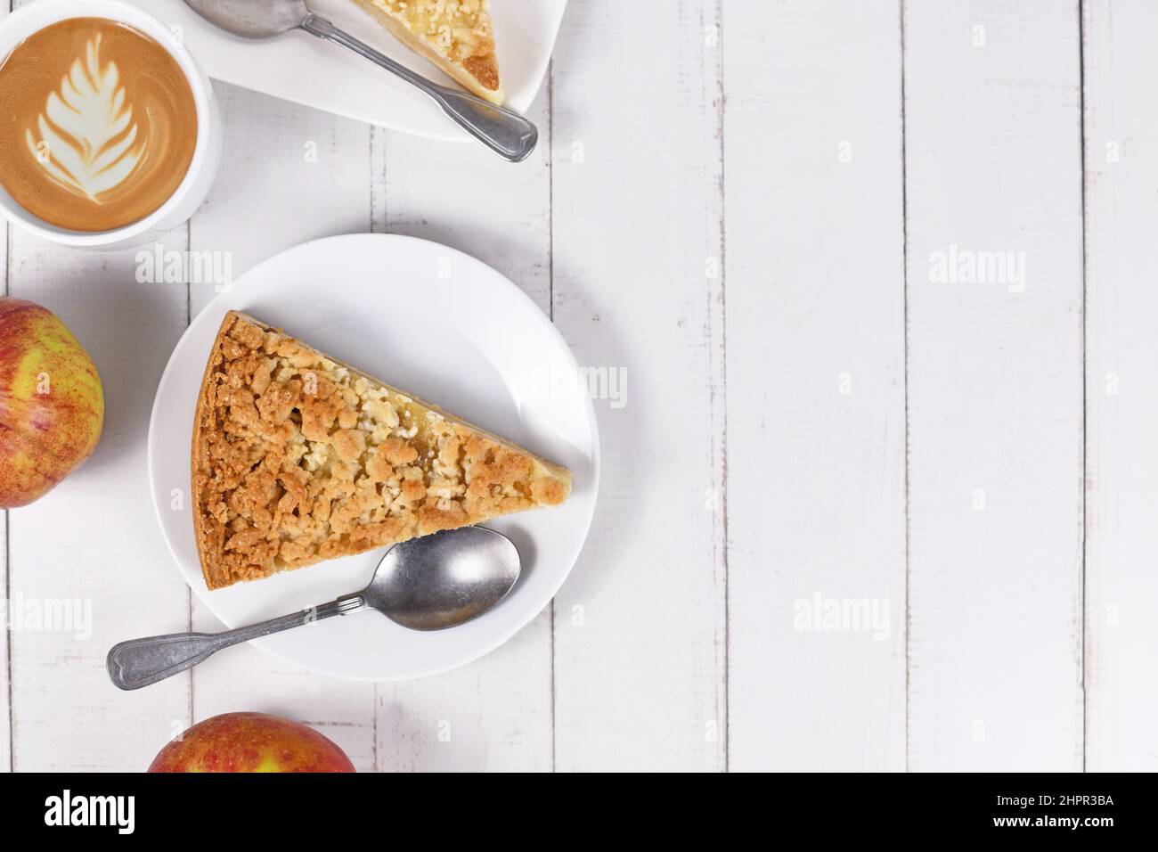 Top view of slice of traditional European apple pie with topping ...