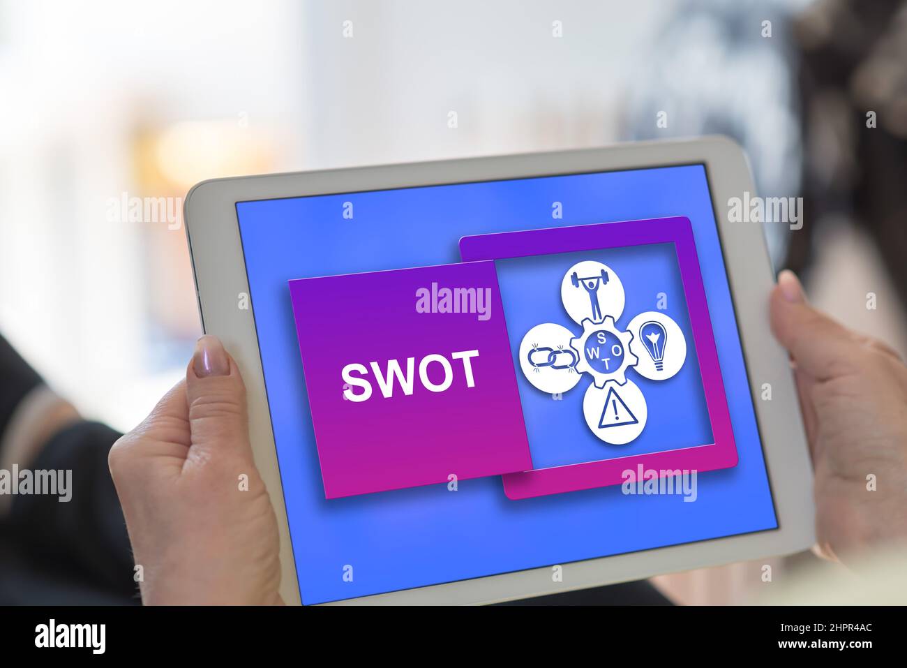 Tablet screen displaying a swot concept Stock Photo - Alamy