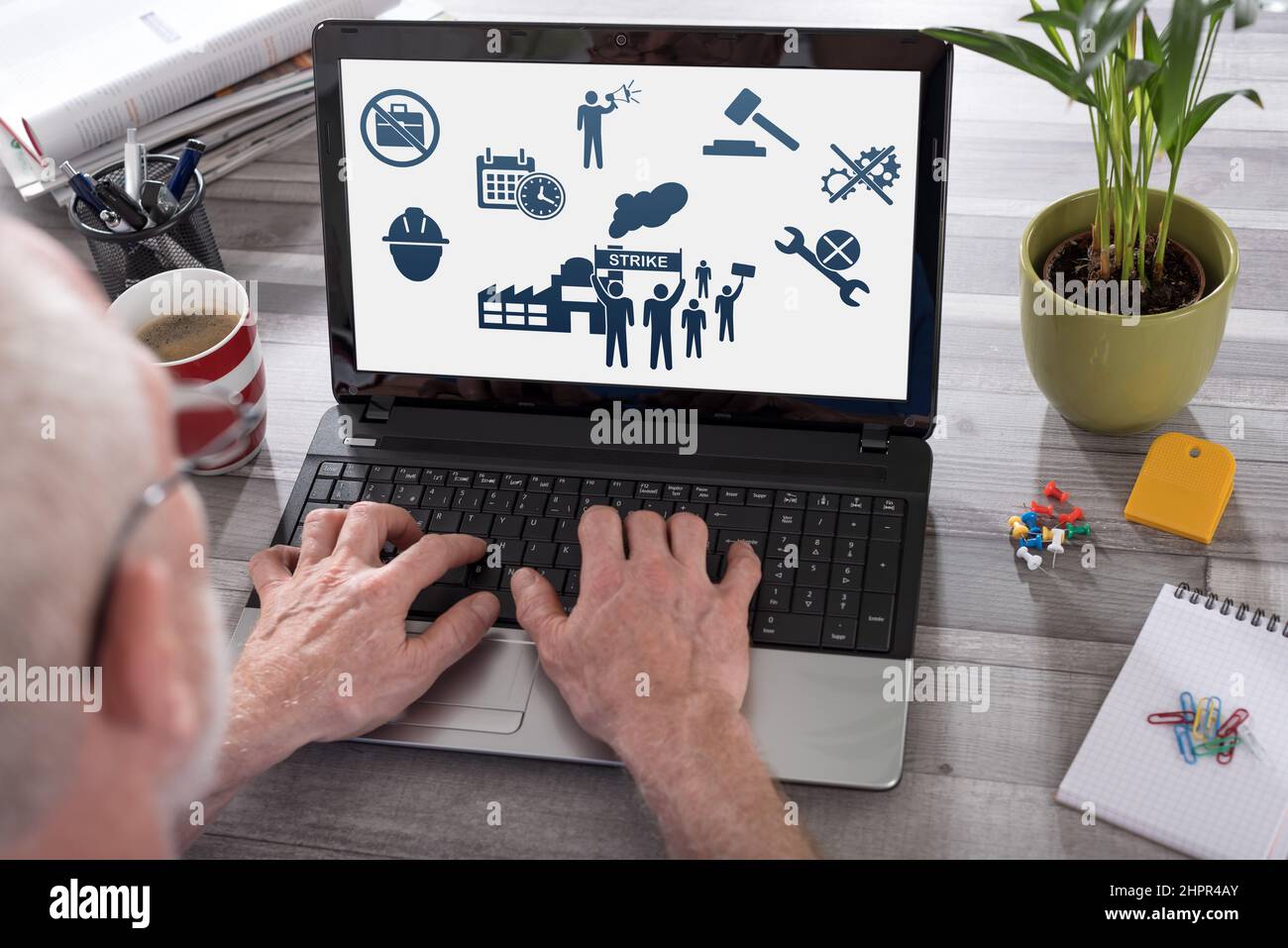 Strike concept shown on a laptop used by a man Stock Photo - Alamy