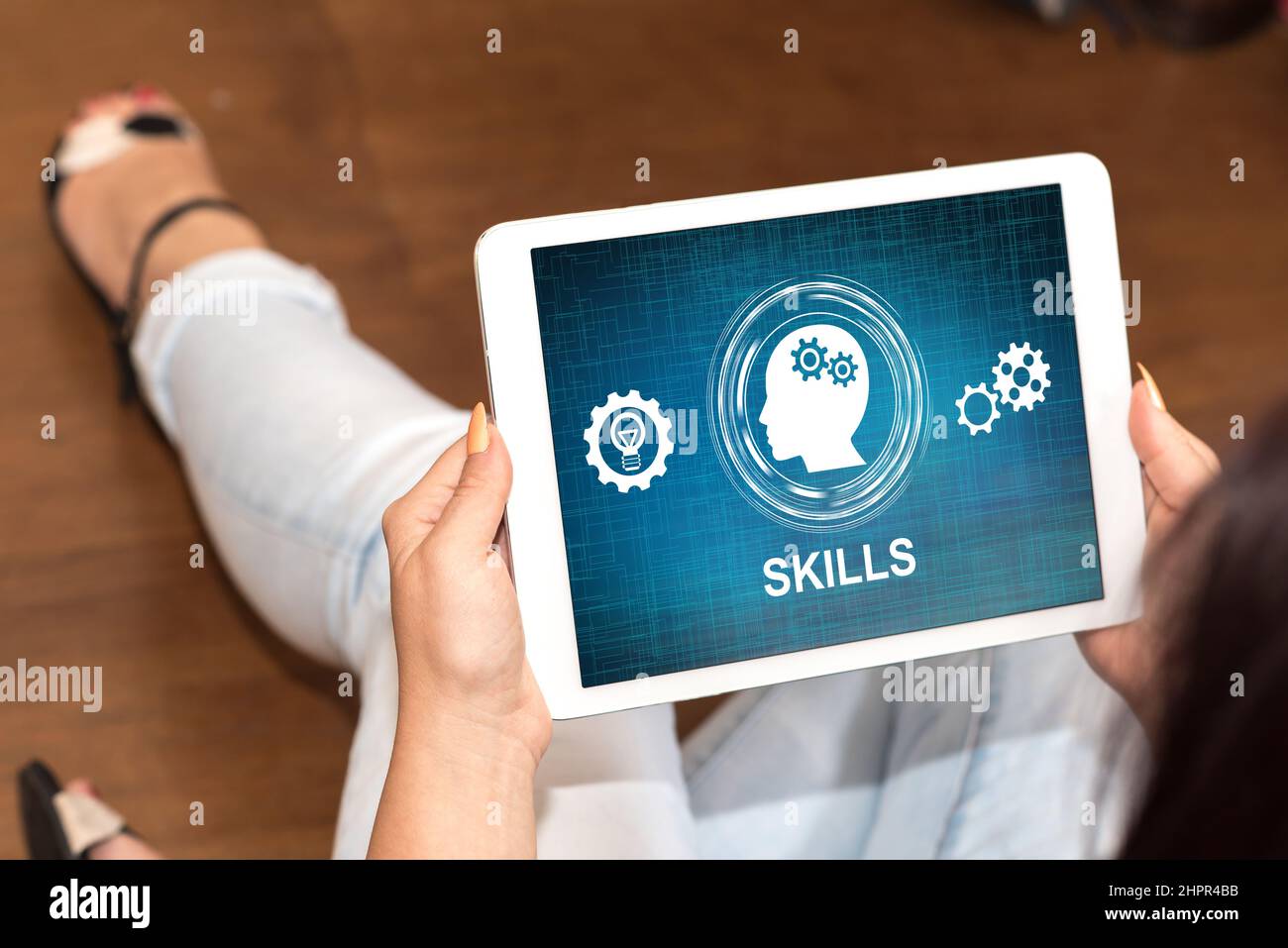 Tablet screen displaying a skills concept Stock Photo - Alamy