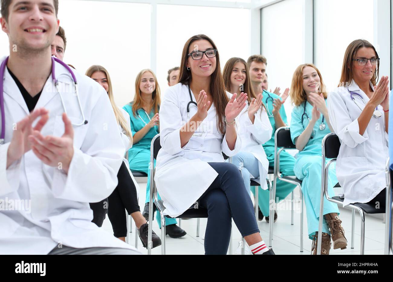 top view. a group of smiling doctors pointing at you Stock Photo - Alamy