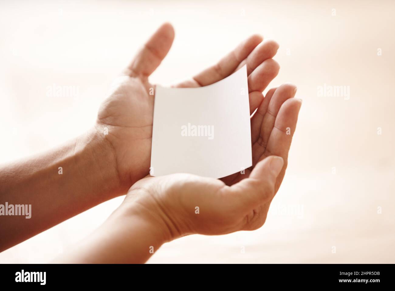 Taking your requests. Hands holding out a blank piece of copyspace like ...