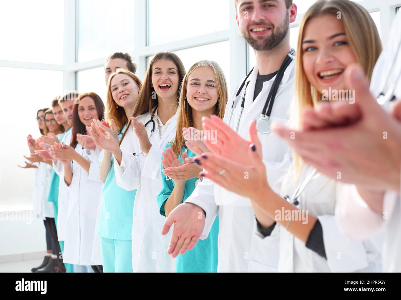 top view. a group of smiling doctors pointing at you Stock Photo - Alamy