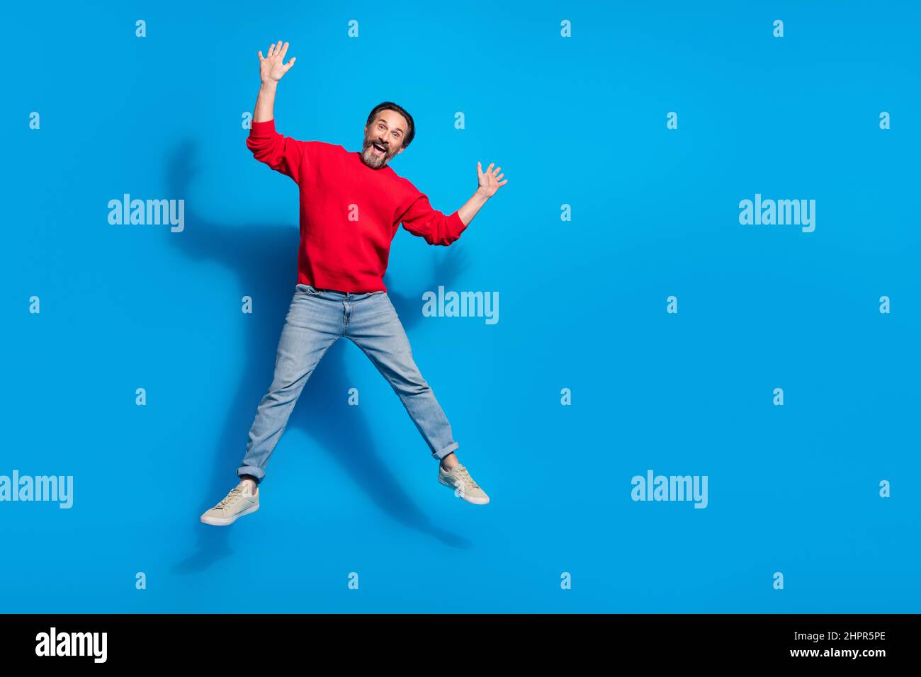Full size photo of excited crazy cheerful guy fooling around jumping up ...