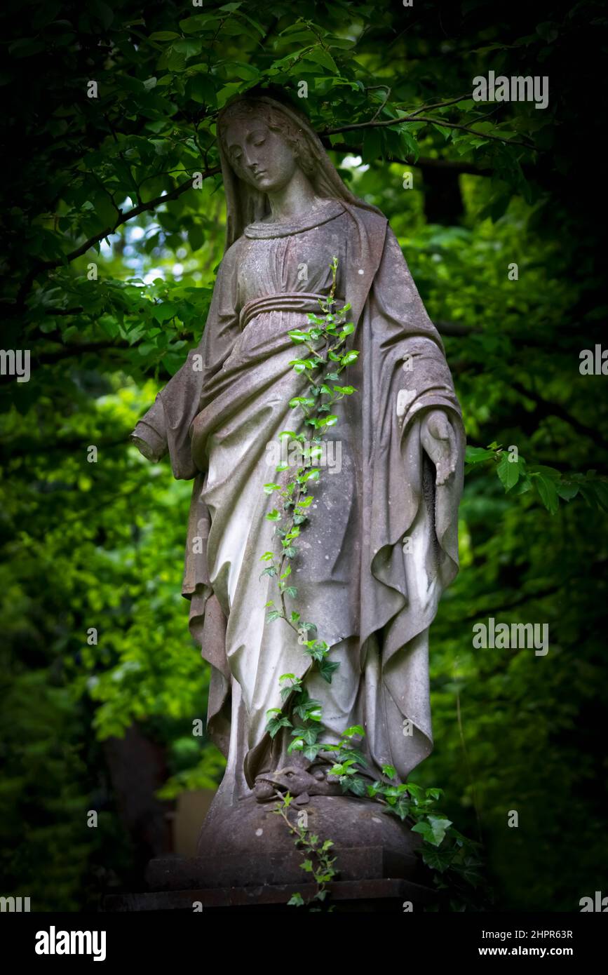 Virgin Mary. Beautiful ancient stone statue. Vertical image Stock Photo ...