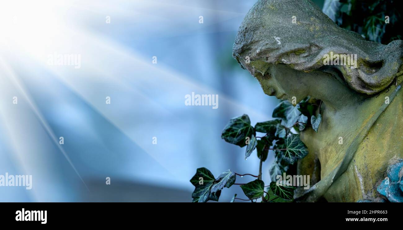 Majestic view of statue of beautiful angel illuminated by sunlight ...
