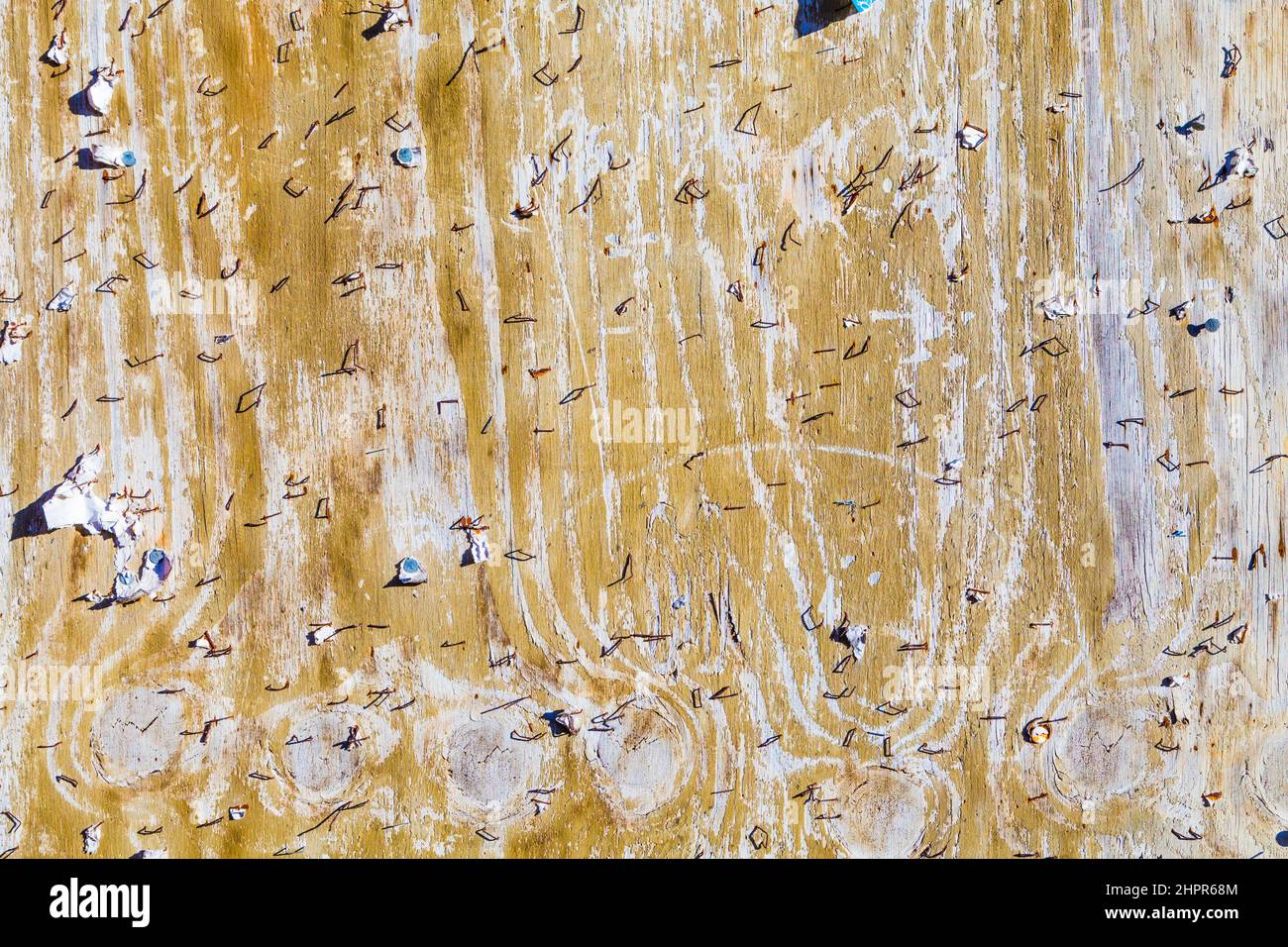 old grungy rotten wooden wall with old pins Stock Photo - Alamy