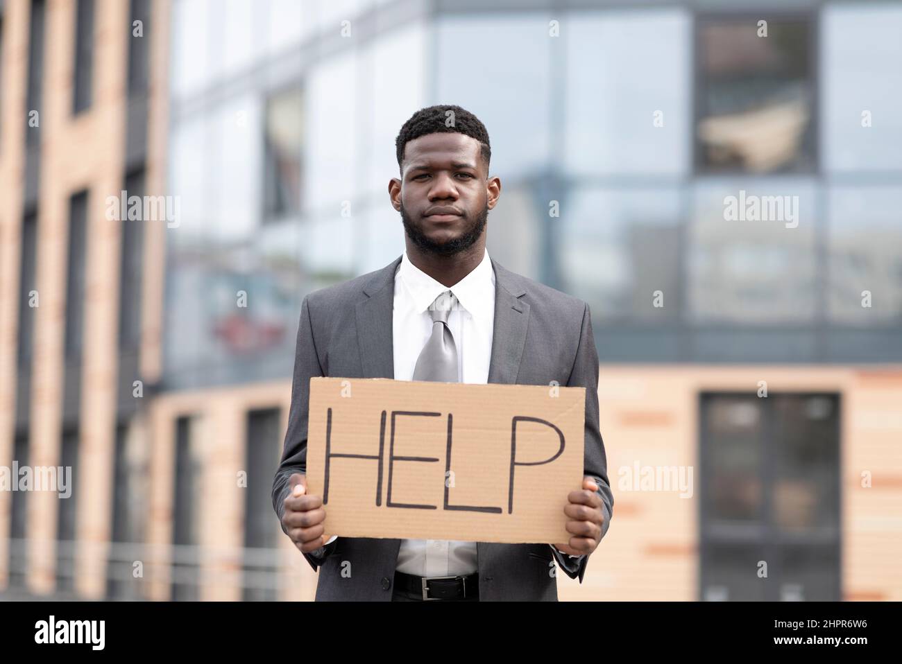 Unhappy despaired african american businessman lost work holding ...