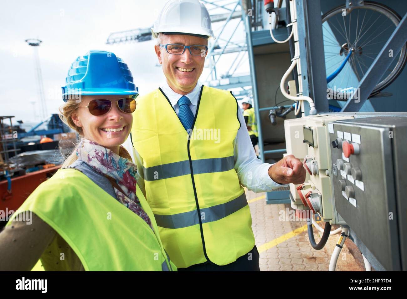 Working together leads to growth in the company. Two engineers standing ...