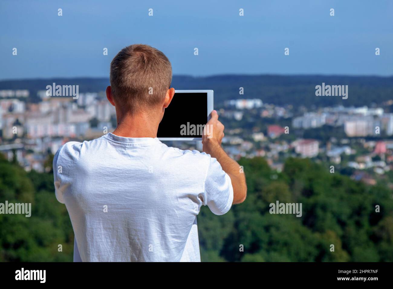 Handsome man taking panoramic pictures. Copy space for design Stock ...