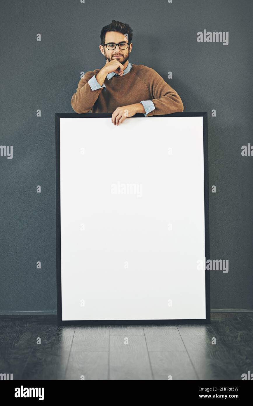 Making a big and bold statement. Studio portrait of a young man holding ...