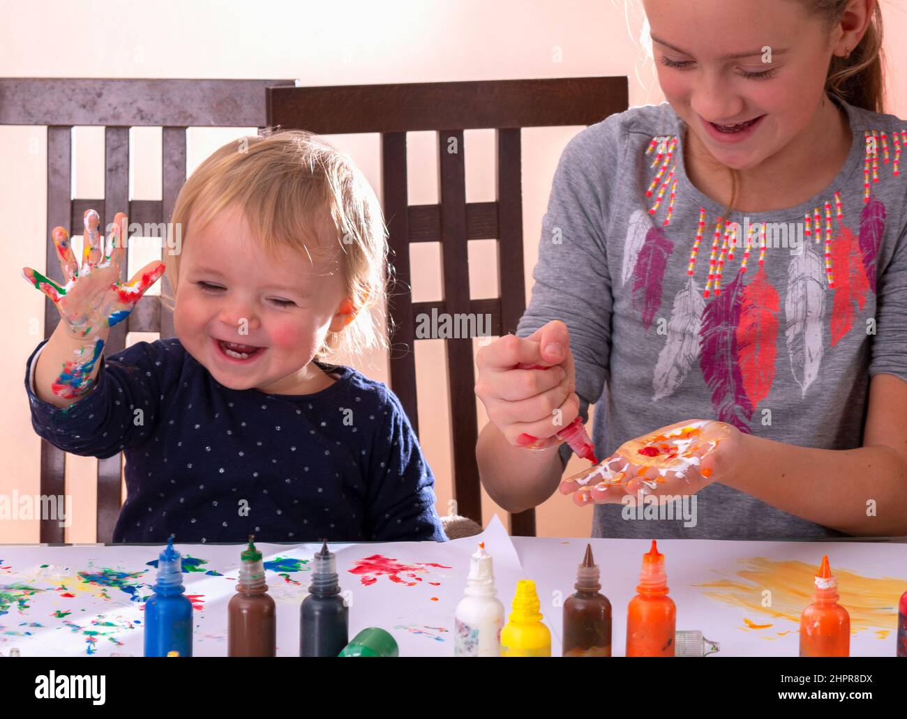 Art lessons for all aged children. Happy children with painted hands ...