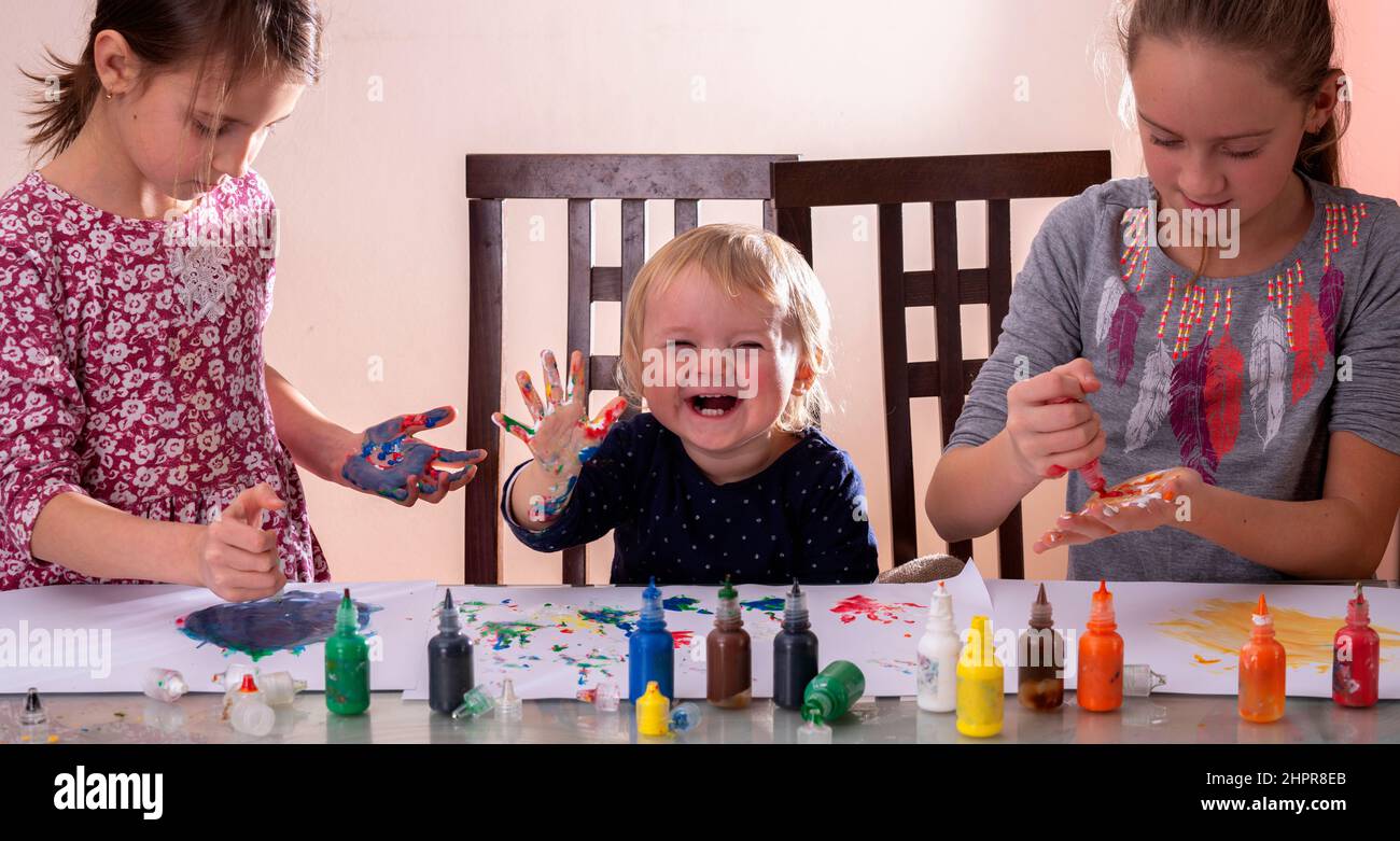 Art lessons for all aged children. Happy children with painted hands ...