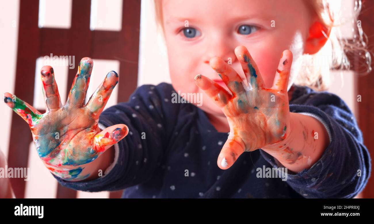 colorful painted hands of beautiful little child girl Stock Photo - Alamy