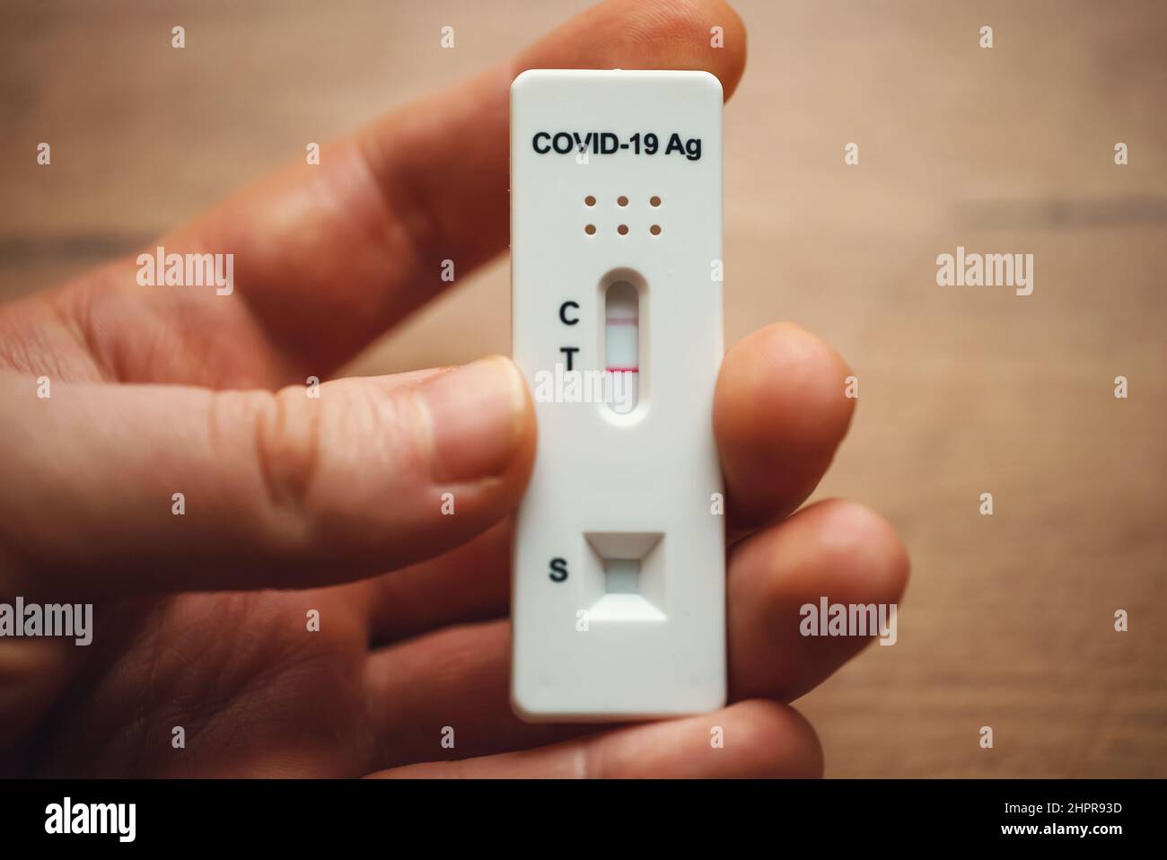 Man holding Positive Antigen Rapid Test for Coronavirus Stock Photo - Alamy