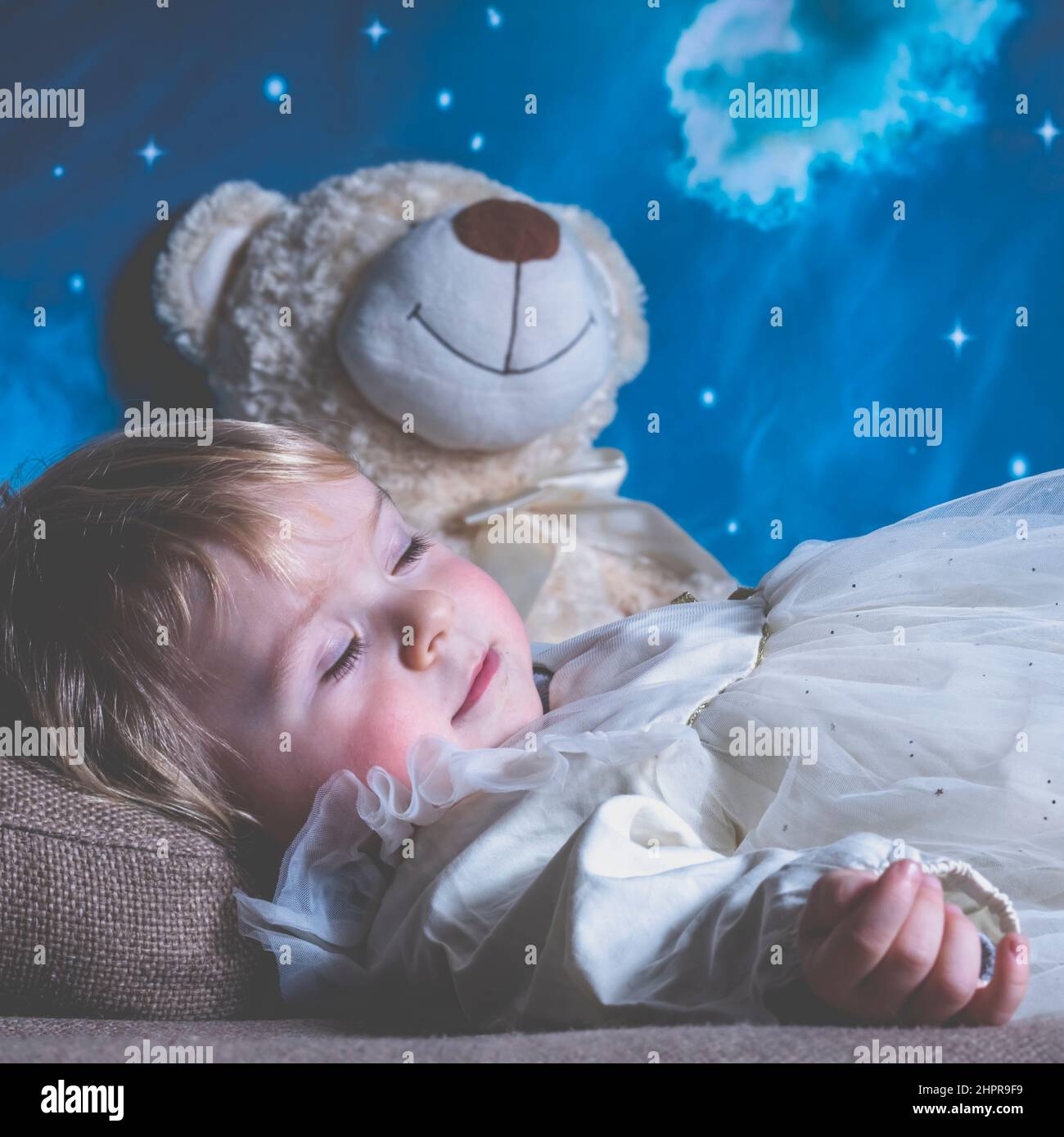 Portrait of little cute child girl is falling asleep with her teddy ...