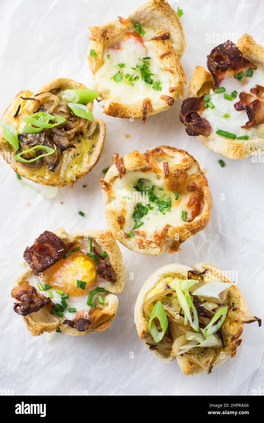 Little bread cups filled with different fillings Stock Photo - Alamy
