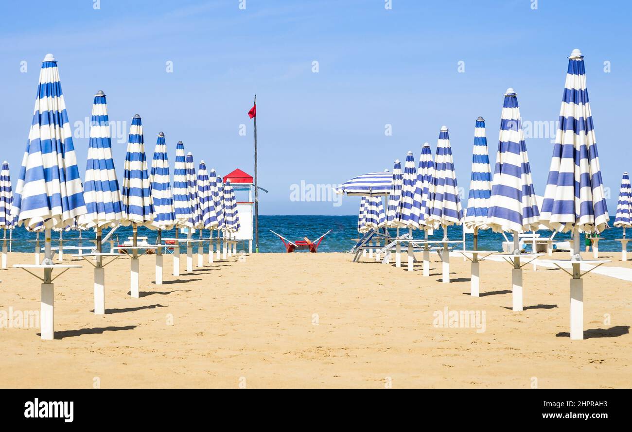 Umbrellas and rescue station at Rimini beach - Italian summer Stock ...