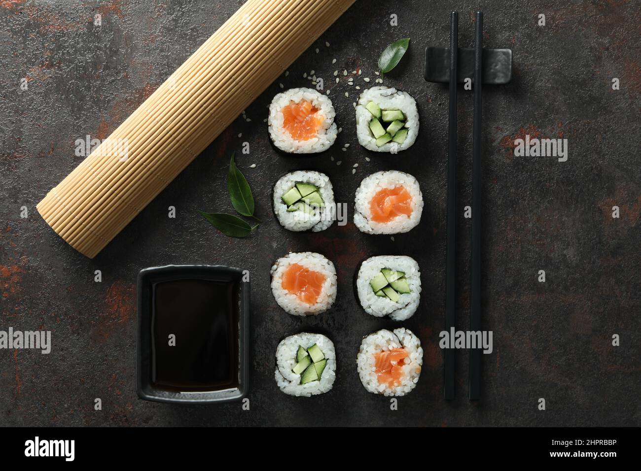 Concept of tasty food with maki on dark textured background Stock Photo ...