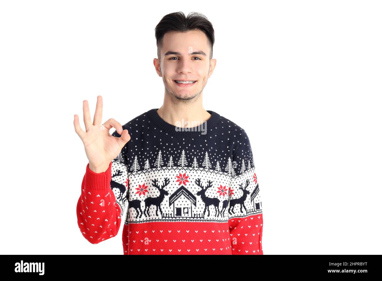 Attractive guy in sweater isolated on white background Stock Photo - Alamy