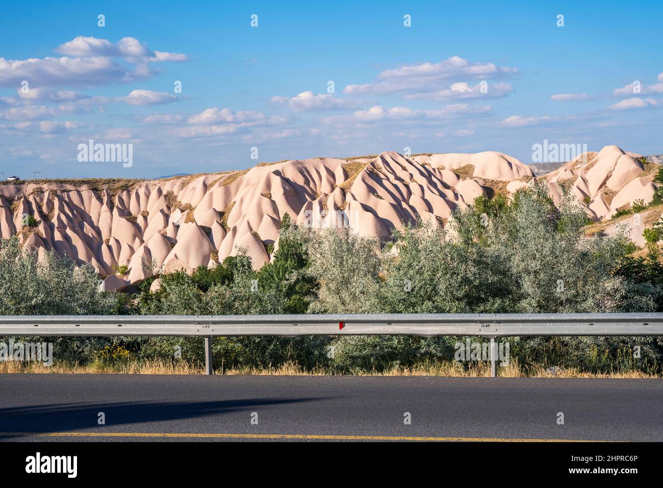 Asphalt road with road markings and mountain landscape of Cappadocia ...