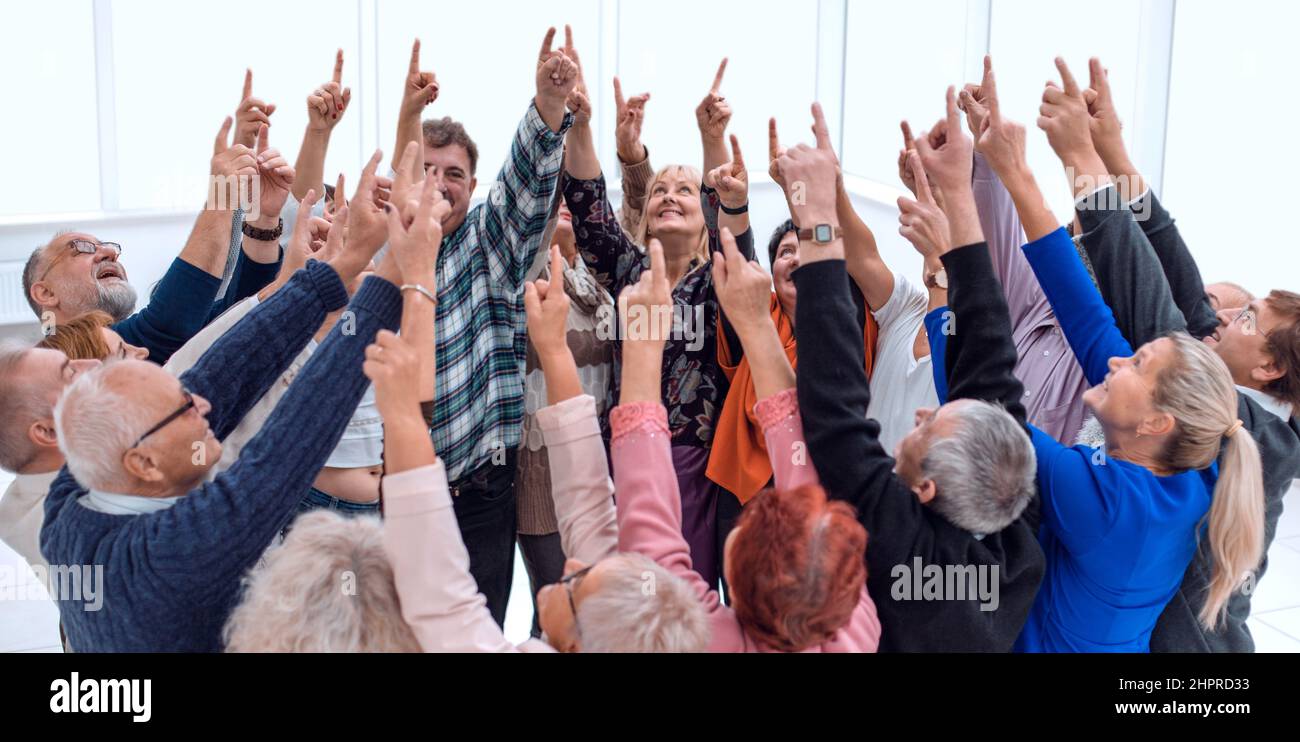 group of advanced people show thumb up Stock Photo - Alamy