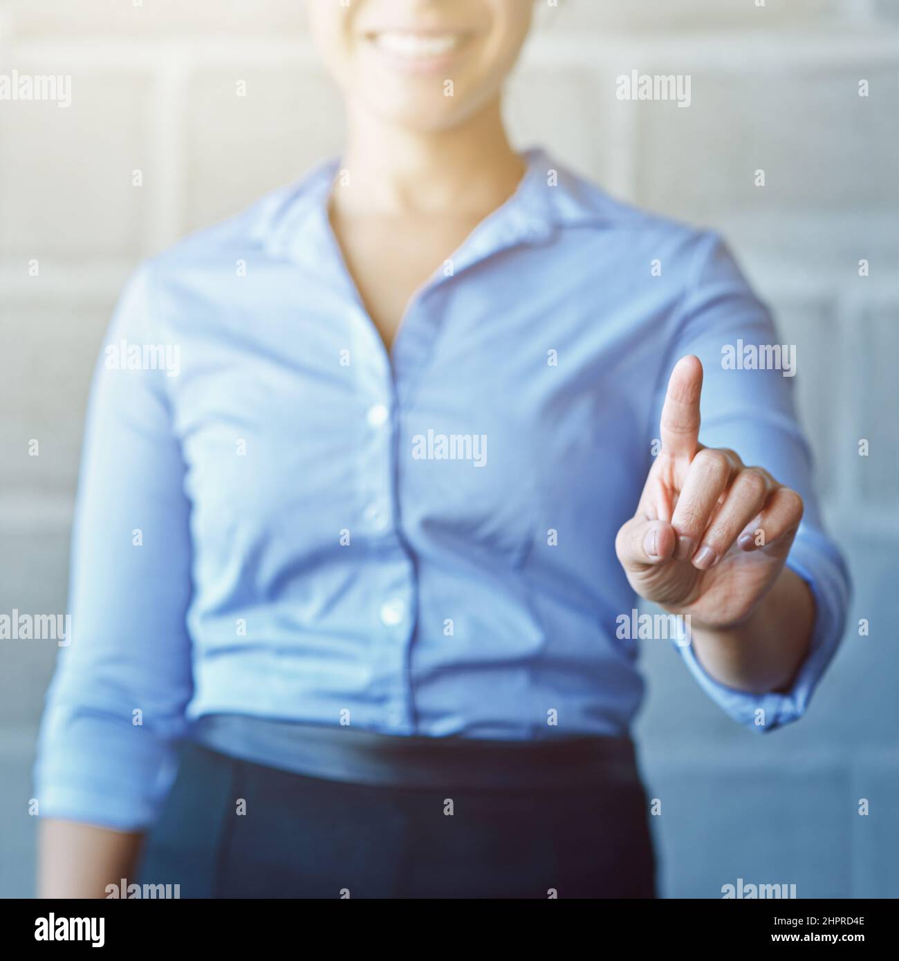 Female employee standing pointing hand hi-res stock photography and ...