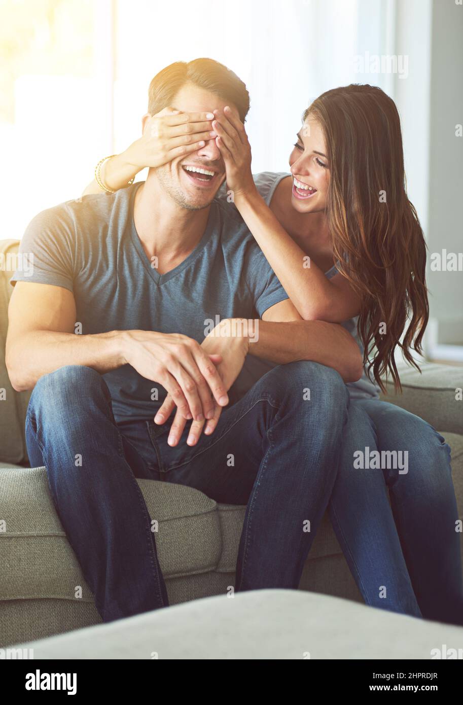 Woman covering husbands eyes hi-res stock photography and images - Alamy