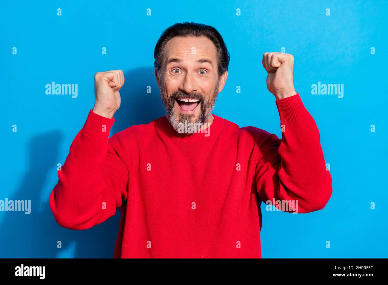 Portrait of attractive cheerful man rejoicing having fun isolated over ...