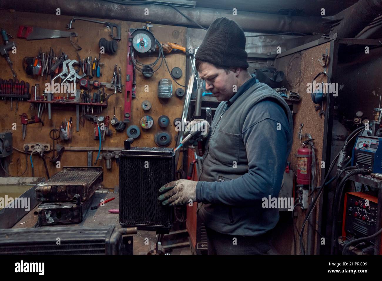 Welding a large car radiator with a gas torch Stock Photo - Alamy