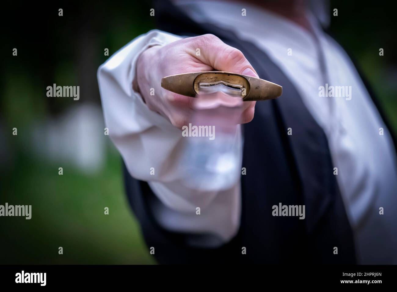 Kung Fu training. The man performs daily exercises with a sword ...