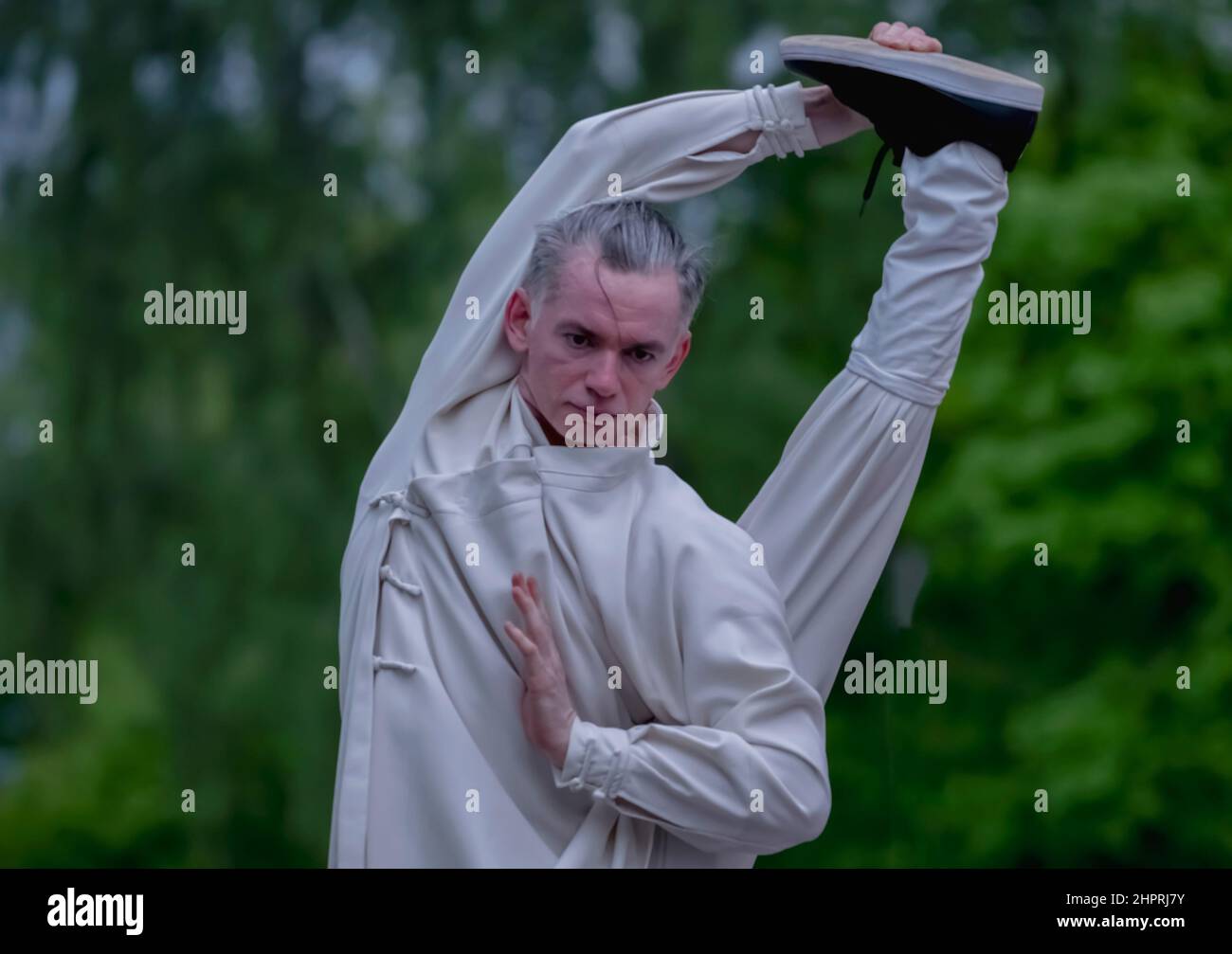 Kung Fu training. The man performs daily physical exercises Stock Photo ...