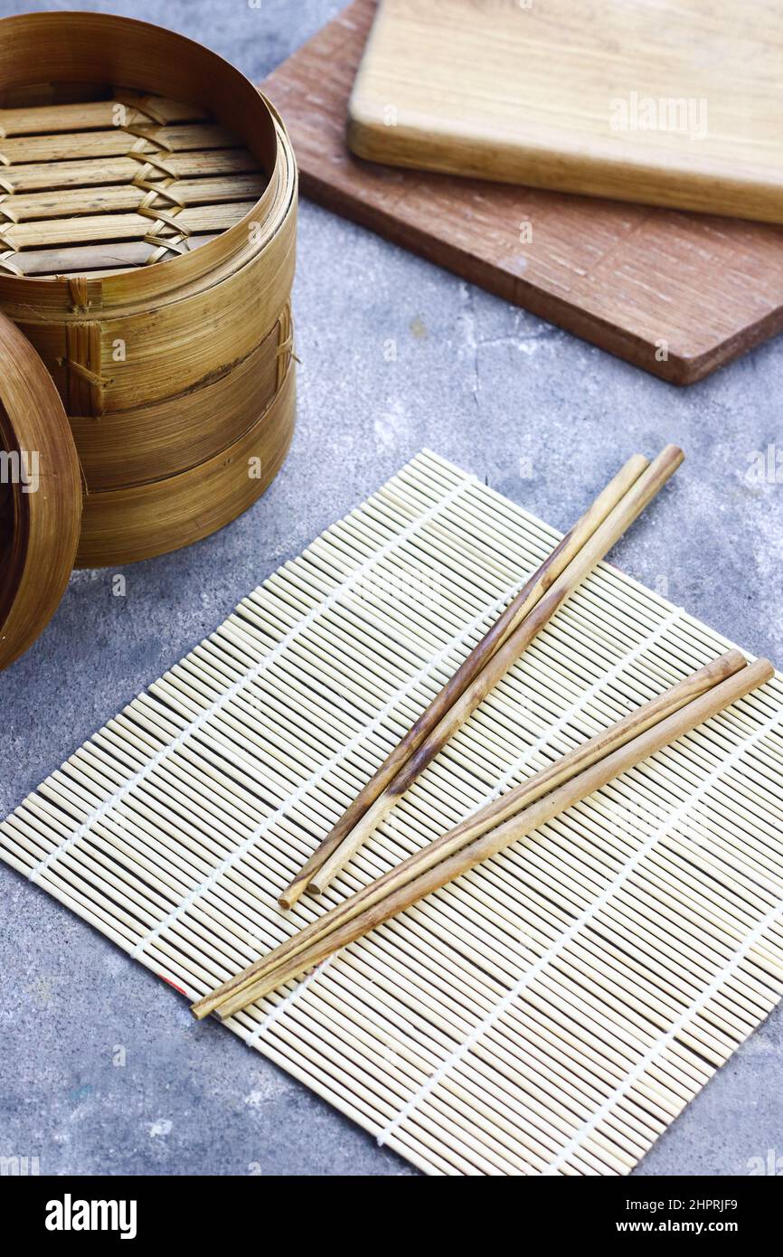 Sushi Roller mat on grey grainy background Stock Photo - Alamy