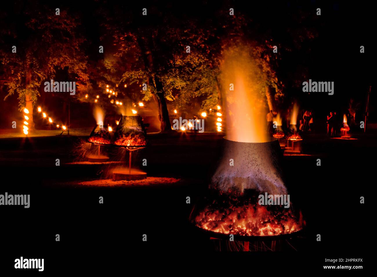 Flaming flower-pots and cast-iron contraptions with red hot glowing ...