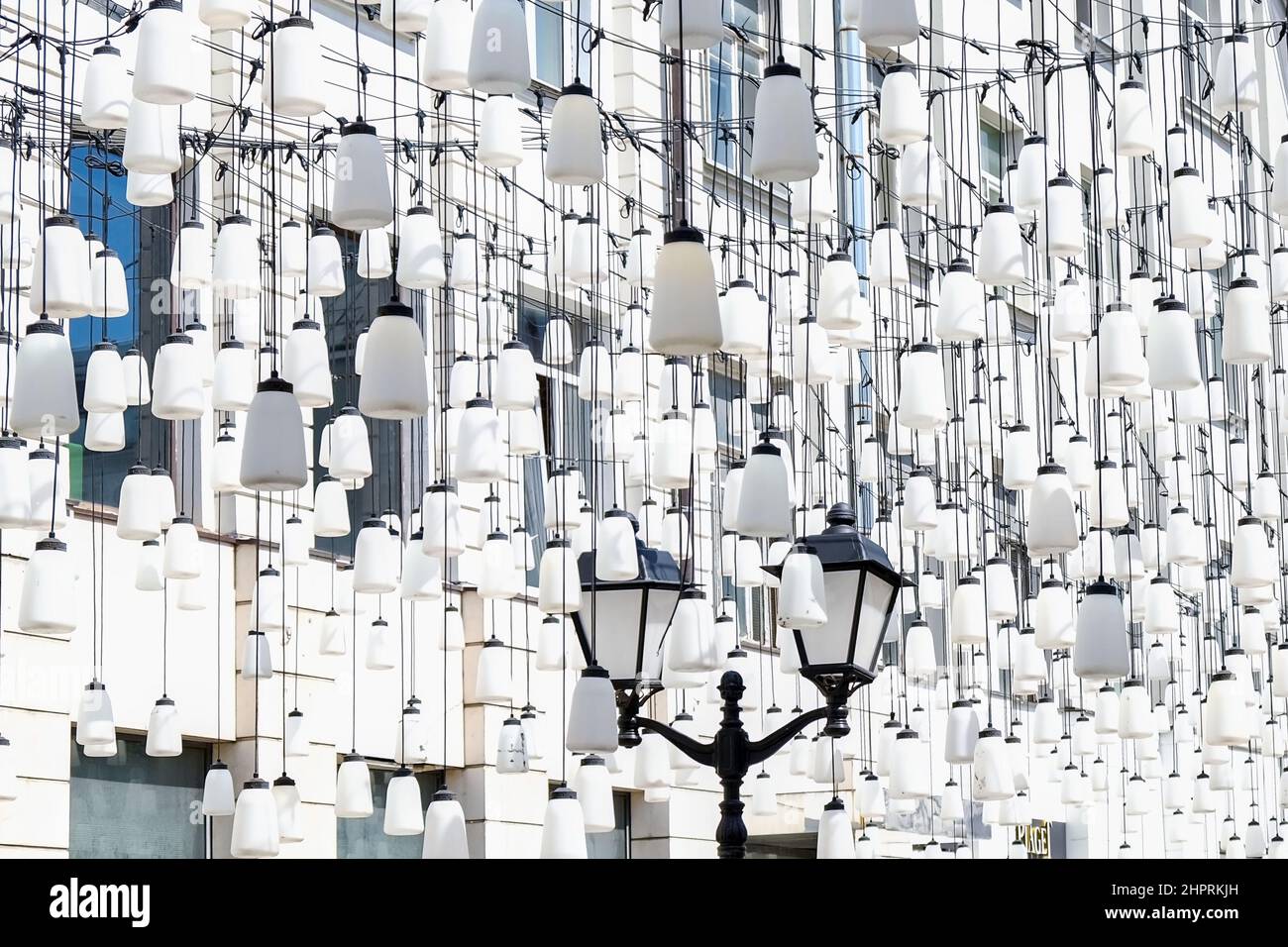 Vintage classical street lantern with white glass shades on background ...