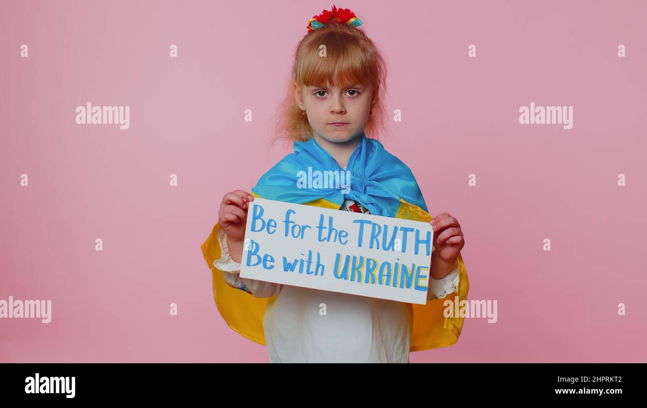 Sad toddler Ukrainian girl kid in embroidery protesting war conflict ...