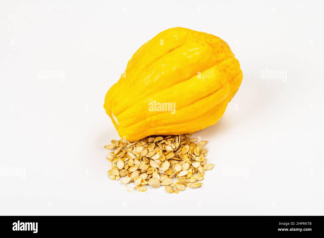 Ripe yellow pumpkin with seeds isolated on white background. Whole ...