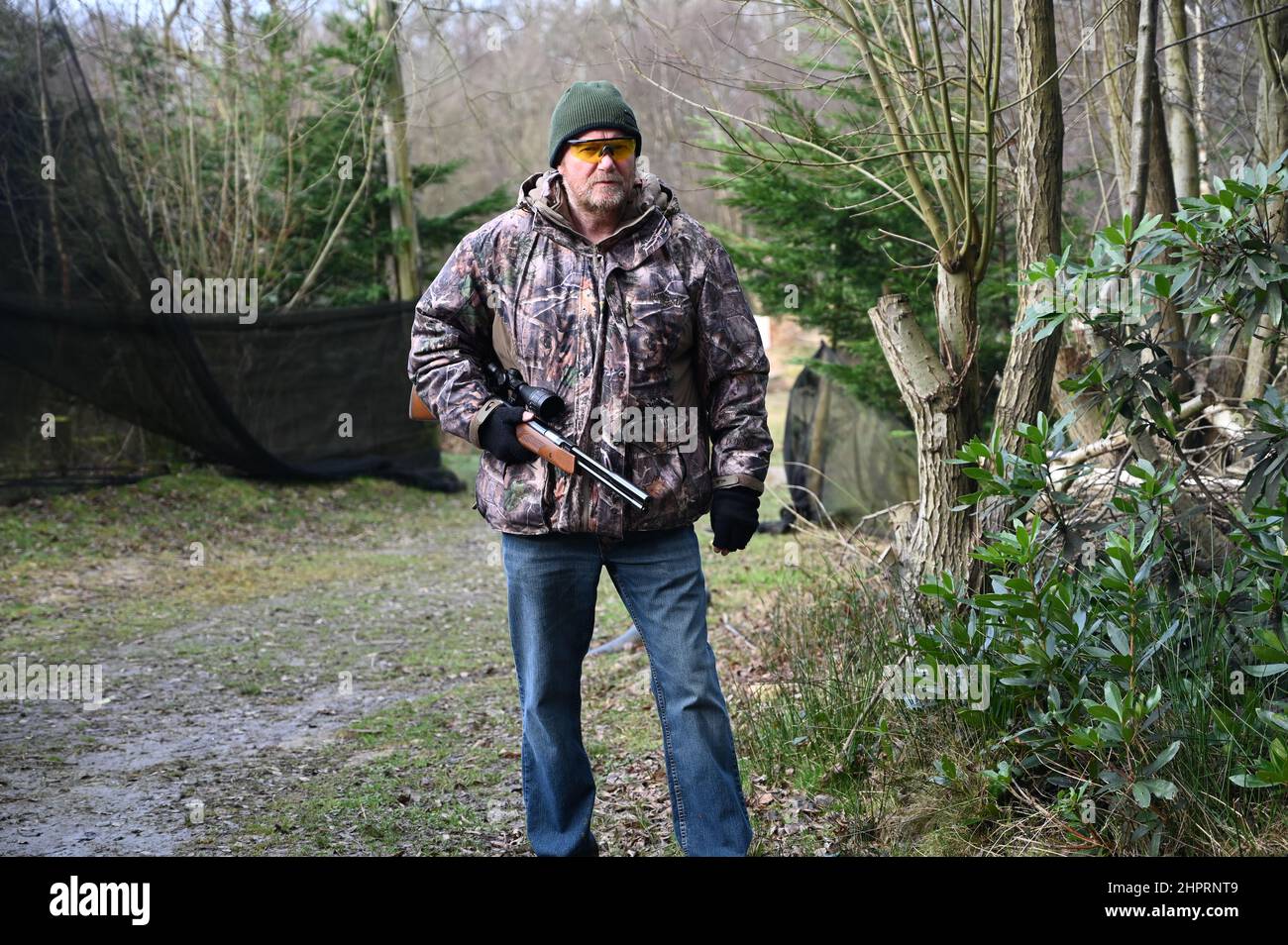 A hunter with a hunting rifle in the UK Stock Photo - Alamy