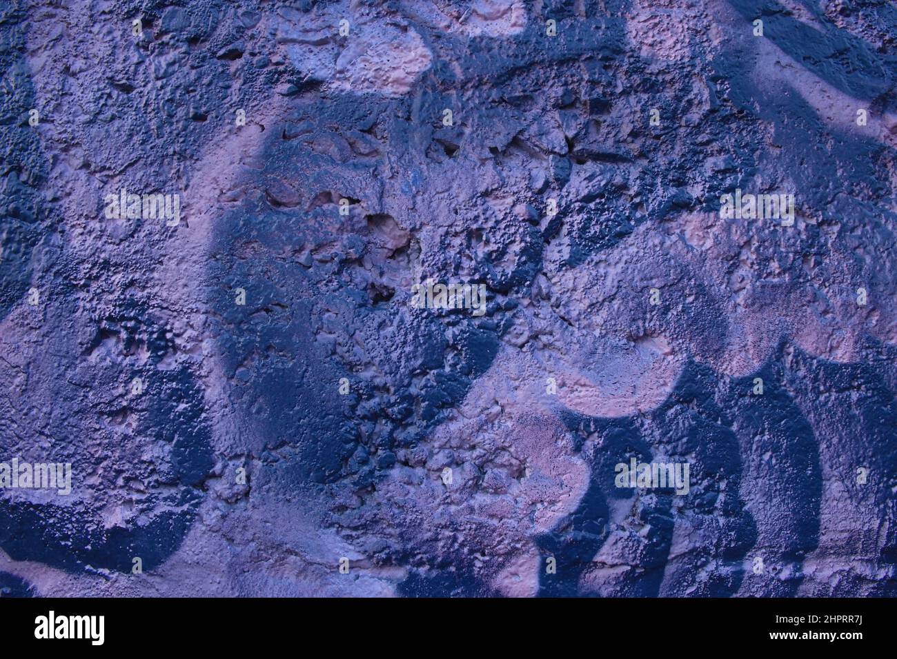 Decorative relief plaster. Dark deep blue and violet painted relief ...